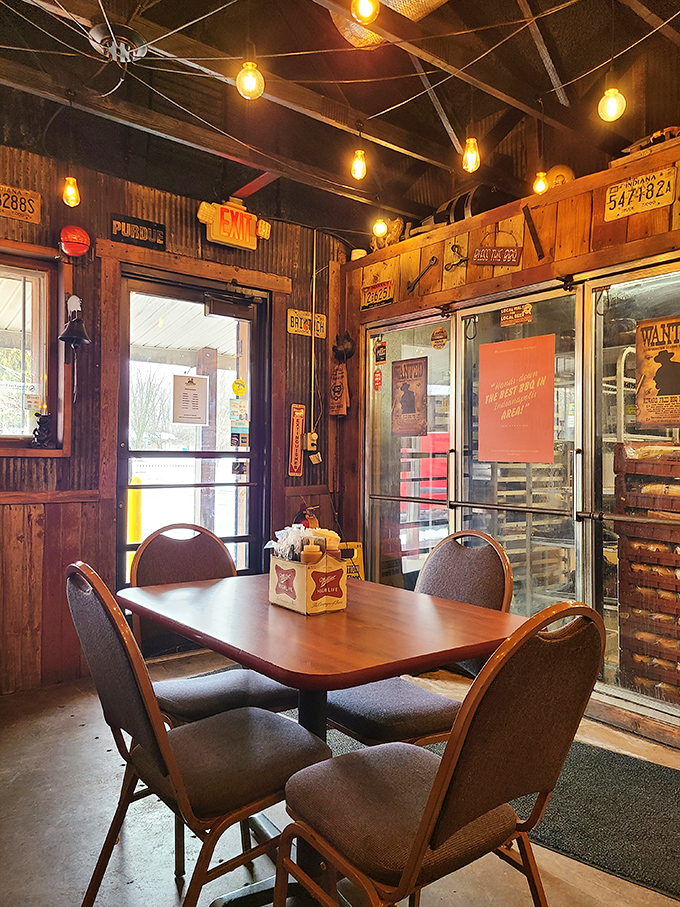 Edison bulbs and reclaimed wood create the perfect atmosphere for serious barbecue conversations and satisfied sighs.