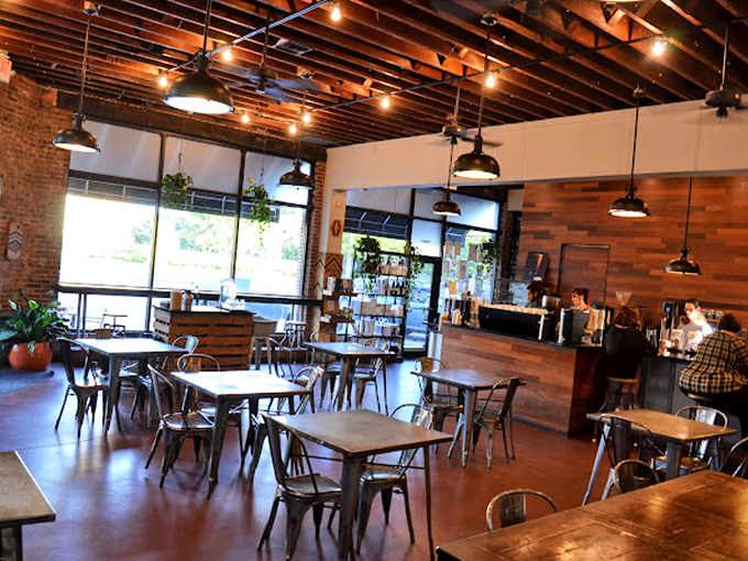 Industrial-chic meets cozy comfort in this thoughtfully designed space where exposed beams and natural light create the perfect backdrop for caffeine-fueled conversations.