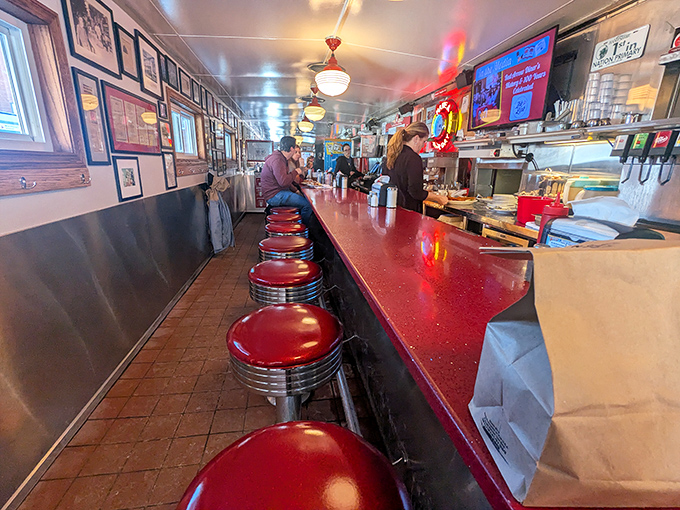Classic Americana lines every inch of this narrow diner paradise. Those red vinyl stools have witnessed countless coffee refills and life-changing hash brown revelations.