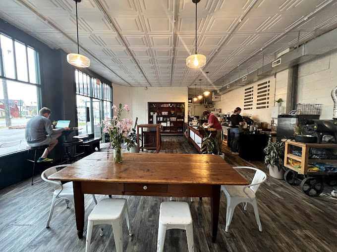Inside, pressed tin ceilings and wooden communal tables create that rare space where "Instagram-worthy" and "actually comfortable" manage to coexist peacefully.