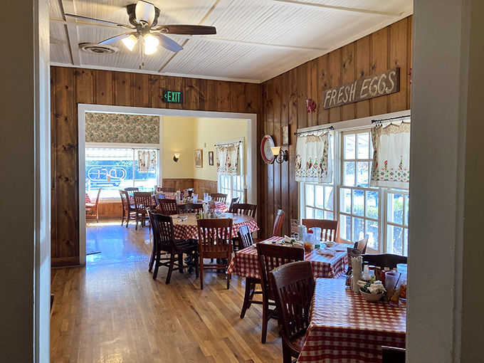 Wood-paneled walls, checkered tablecloths, and a "FRESH EGGS" sign that's not kidding around. This dining room has witnessed more food epiphanies than a cooking show marathon.