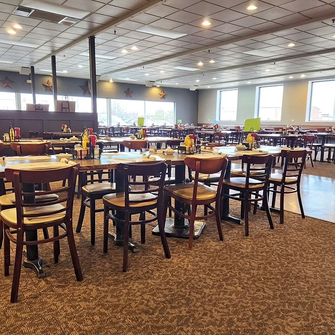 Inside, wooden tables and chairs create the perfect backdrop for comfort food conversations, where regulars become family and newcomers feel instantly welcome.