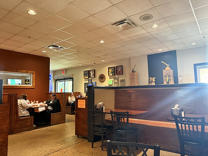 Simple wooden booths where BBQ dreams come true. No fancy frills needed when the food does all the talking.