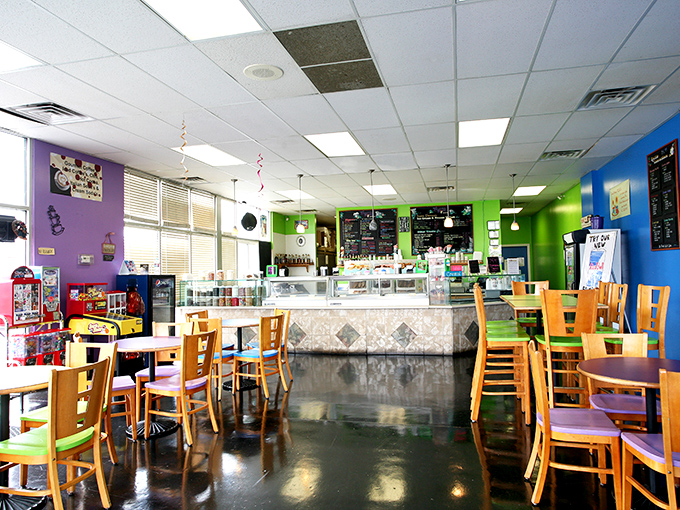 Step inside and the vibrant color scheme hits you like a happy explosion&mdash;purple, green, and blue walls create the perfect backdrop for ice cream adventures. 
