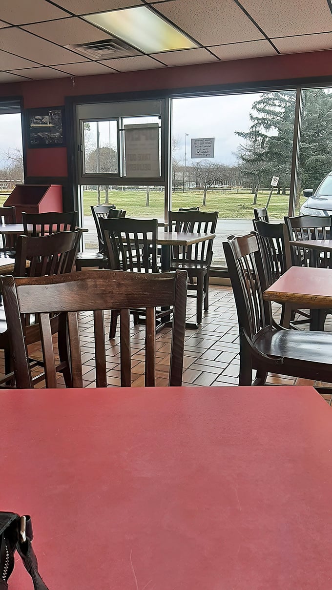 Simple wooden chairs and bright windows create the perfect setting for barbecue contemplation. No distractions, just you and smoked meat nirvana.