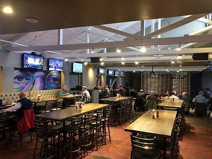 The spacious interior blends rustic charm with modern comfort, where communal tables invite strangers to become friends over shared barbecue bliss. 