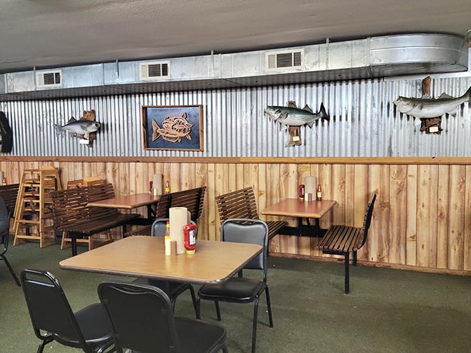 Rustic wood paneling meets corrugated metal in this no-frills dining room where mounted fish silently approve of your buffet selections.