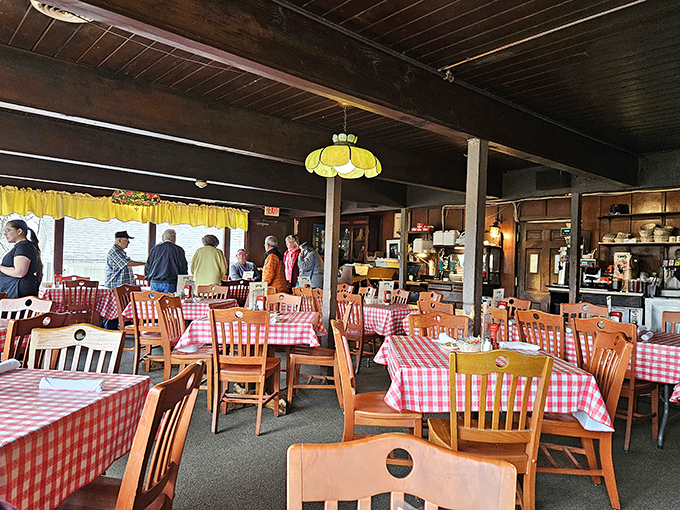 Red and white checkered tablecloths set the stage for culinary nostalgia, where conversations flow as freely as the gravy in this no-pretense dining room.