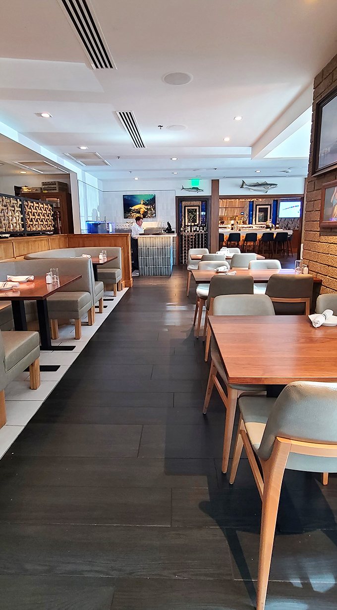 Clean lines, comfortable booths, and nautical touches create an atmosphere that whispers "coastal getaway" while the Arizona sun blazes outside.