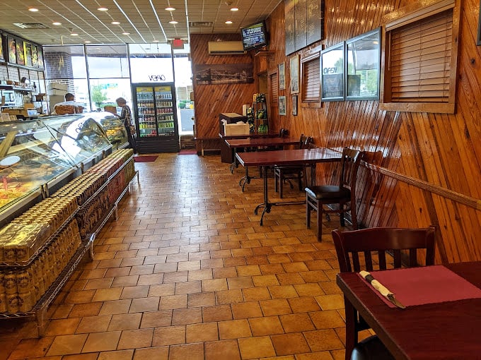 Wood paneling that's seen more sandwich debates than a marriage counselor &ndash; classic deli interiors never go out of style.