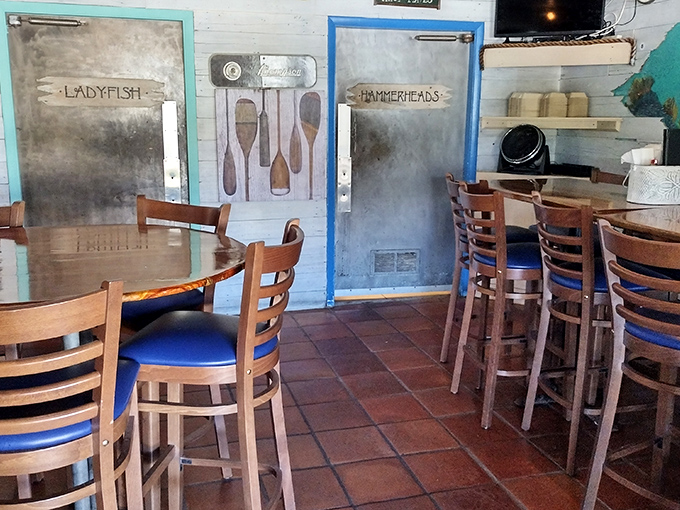 Those bathroom doors labeled "Ladyfish" and "Hammerheads" tell you everything about this place's character. Nautical charm that's earned, not manufactured.