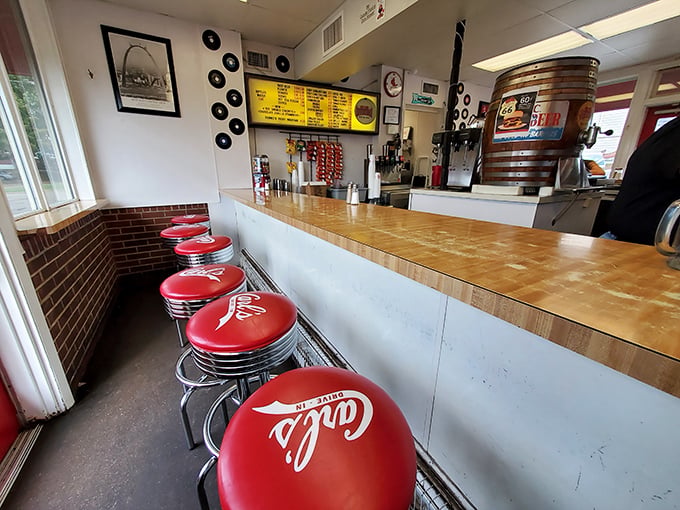 Those cherry-red counter stools aren't just seating&mdash;they're front-row tickets to a burger ballet performed daily by grill masters who've perfected their craft over decades.