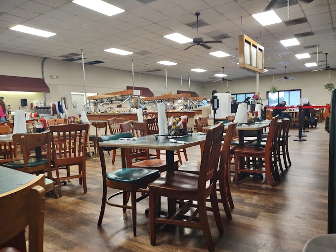 The dining room might not win design awards, but those wooden chairs have supported generations of satisfied customers who came for the food, not the feng shui.