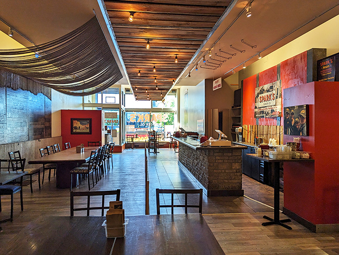 Modern rustic meets burger paradise inside Spark's, where wooden ceiling beams and thoughtful design create the perfect backdrop for serious eating.