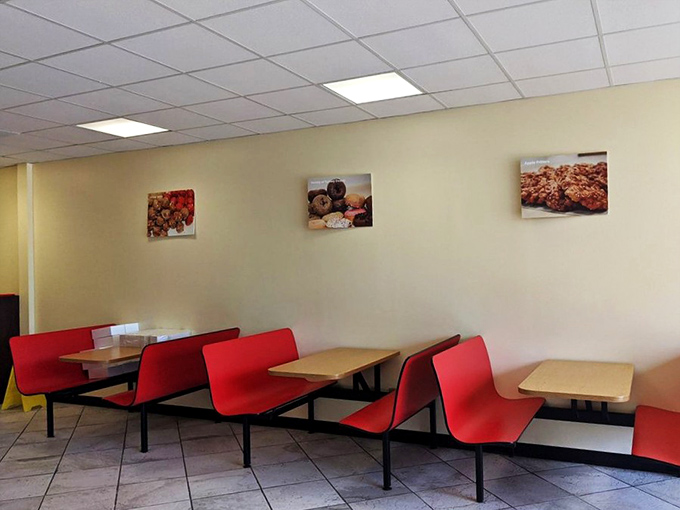 Simple red booths and clean lines create the perfect canvas for donut appreciation&mdash;like a museum where the art disappears bite by bite.