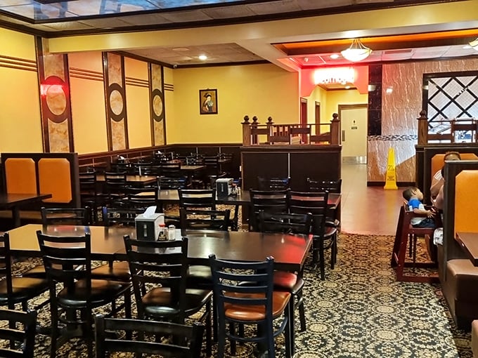 Warm yellow walls and dark wood create an inviting atmosphere where food dreams come true. It's like the dining room was designed specifically for your "I'm about to eat everything" ambitions.