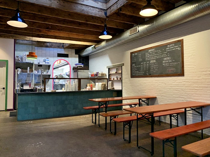 Wooden beams, white brick walls, and communal tables create the perfect backdrop for the impending meat sweats you'll happily endure. 