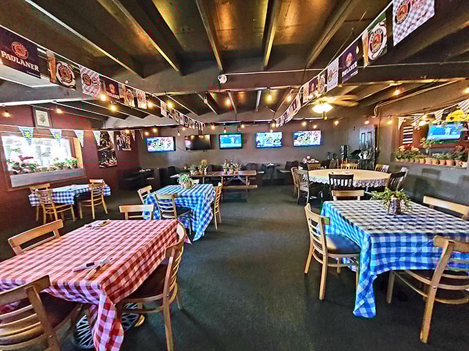 Red and blue checkered tablecloths pop against wooden furniture, creating that perfect "Gem&uuml;tlichkeit"&mdash;a coziness that welcomes you like a warm Alpine hug.