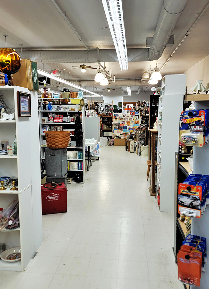 Treasure hunters navigate aisles where Hot Wheels and history coexist in perfect harmony. That Coca-Cola cooler probably remembers when soda cost a nickel!