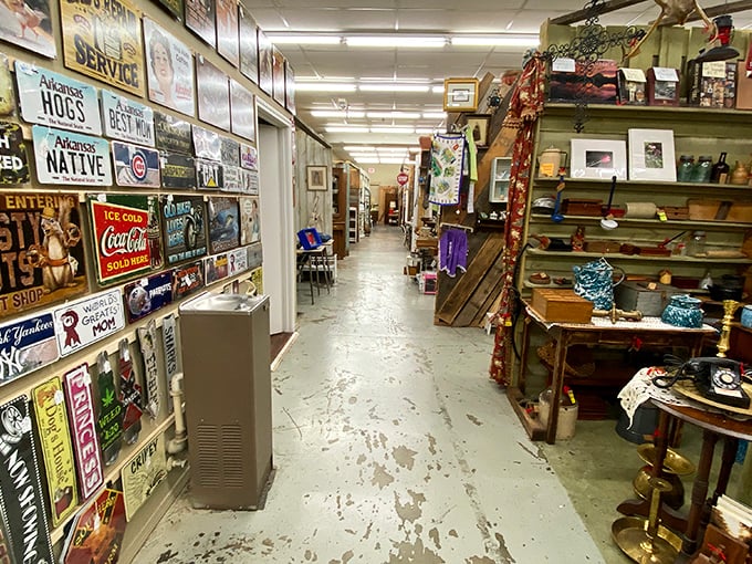 Vintage signs line the walls like a museum of American advertising history. Each aisle promises new discoveries and potential treasures.
