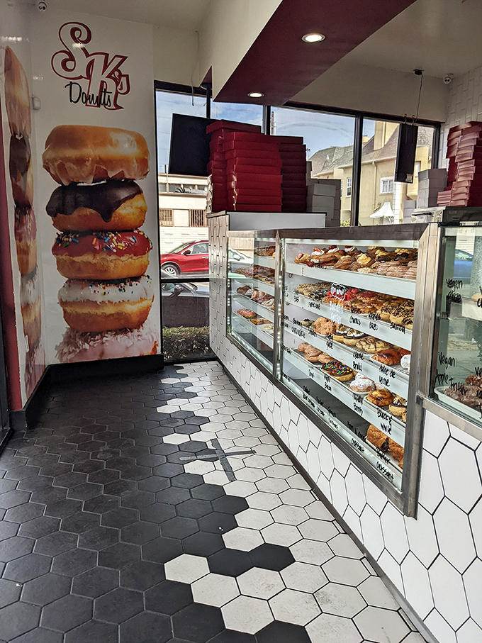 Inside, a donut mural stands sentinel over display cases filled with temptation. The hexagonal floor tiles are practically a donut shop birthright in LA.