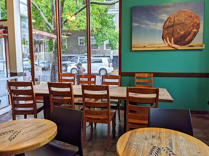 Green walls and wooden tables create the perfect backdrop for your impending carb euphoria. The bread photo watches over diners like a delicious guardian angel. 