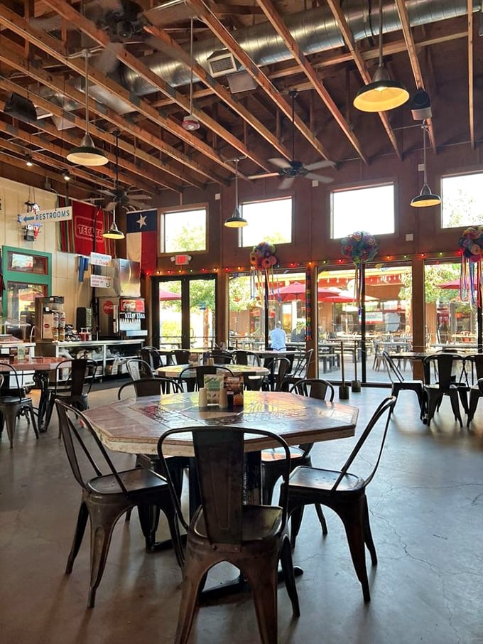 Exposed wooden beams, Texas flags, and metal chairs create that perfect "come as you are" atmosphere where memories are made.