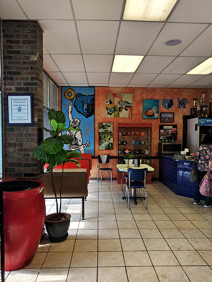 Inside Gibson's, Memphis pride adorns the walls while retro tables invite you to sit and contemplate the serious business of donut selection.
