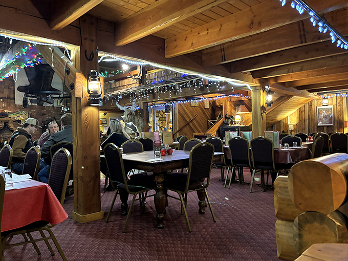 Step inside and you're transported to a Western wonderland where log cabin charm meets serious steak business. Those twinkling lights aren't just for show!
