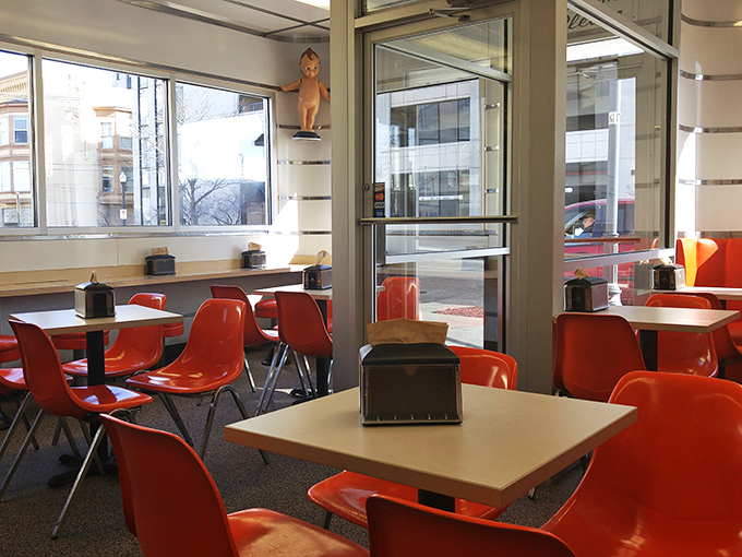 Those vibrant orange chairs aren't just seating&mdash;they're time machines to when "fast food" was still a novel concept and tasted like someone's grandma made it.