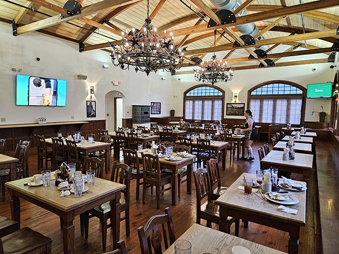 Wooden beams soar overhead in this cathedral to comfort food, where communal tables invite strangers to become friends over steins of beer.