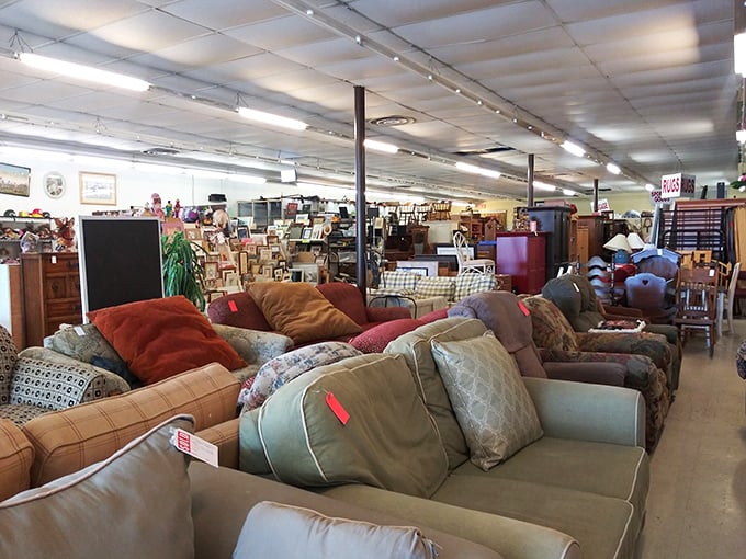 A sea of sofas awaits new homes, each with stories to tell and naps to host. Comfort archaeology at its finest!