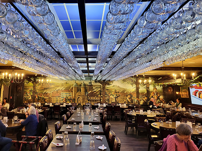 Hundreds of beer steins hang from the ceiling like a chandelier designed by someone who really, really loves a good brew.