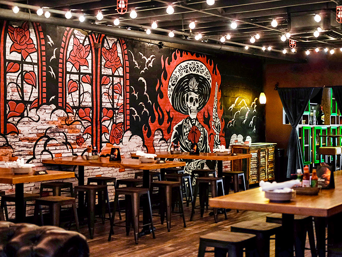 Day of the Dead artwork watches over diners like spiritual culinary guides, while string lights create the perfect atmosphere for taco-fueled revelations.