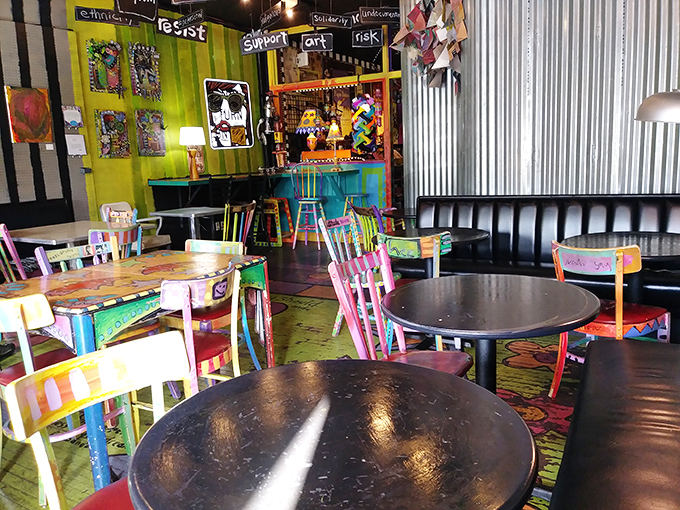 Mismatched chairs that look like they were rescued from different decades and given psychedelic makeovers. Sitting here feels like joining a very colorful family reunion.