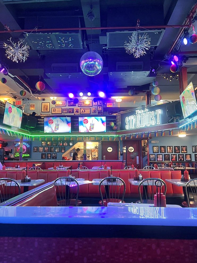 Inside, a disco ball hangs above red vinyl booths while the mezzanine awaits performers who'll turn your meal into an impromptu Broadway revue.