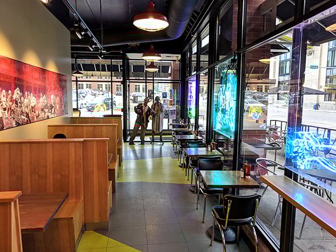 Where post-apocalyptic decor meets gourmet indulgence. The neon accents cast an eerie glow that somehow makes you hungrier rather than terrified.