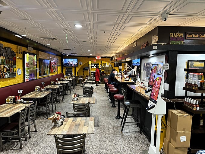 Yellow brick walls and classic diner seating create the perfect backdrop for the breakfast drama about to unfold on your plate.