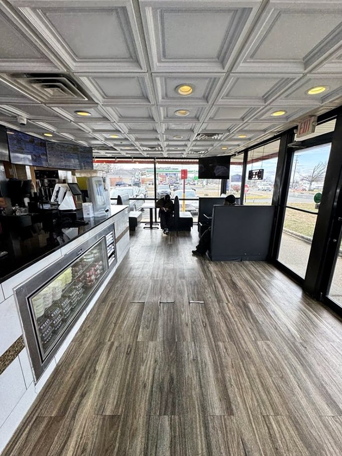 Clean lines, wood-look flooring, and an unexpectedly elegant coffered ceiling &ndash; this isn't just a chicken joint, it's a poultry palace with priorities straight.