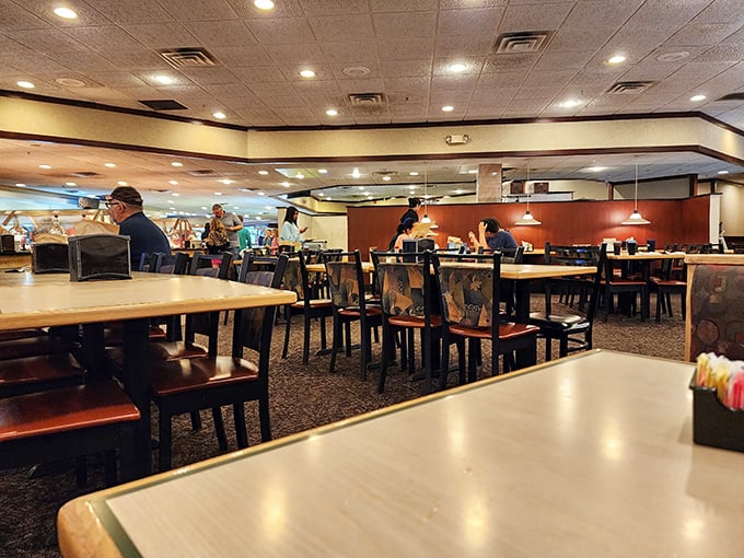 Inside, the spacious dining room offers the perfect backdrop for the impending food marathon. Strategic table placement allows for maximum plate-to-mouth efficiency.