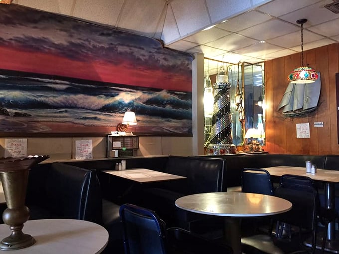Nautical dreams meet diner reality inside Anchor Grill, where ocean paintings and wood paneling create the perfect backdrop for comfort food conversations.