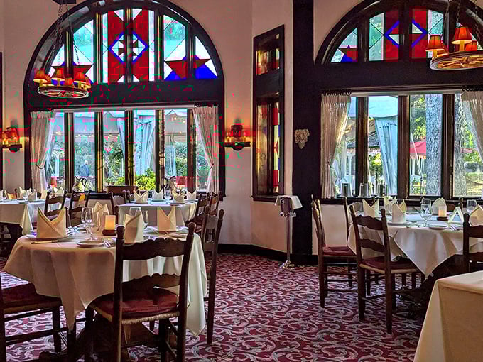 Stained glass windows bathe the dining room in jewel-toned light, creating an atmosphere that's part cathedral, part grandmother's special dining room. Every meal here feels like a celebration.