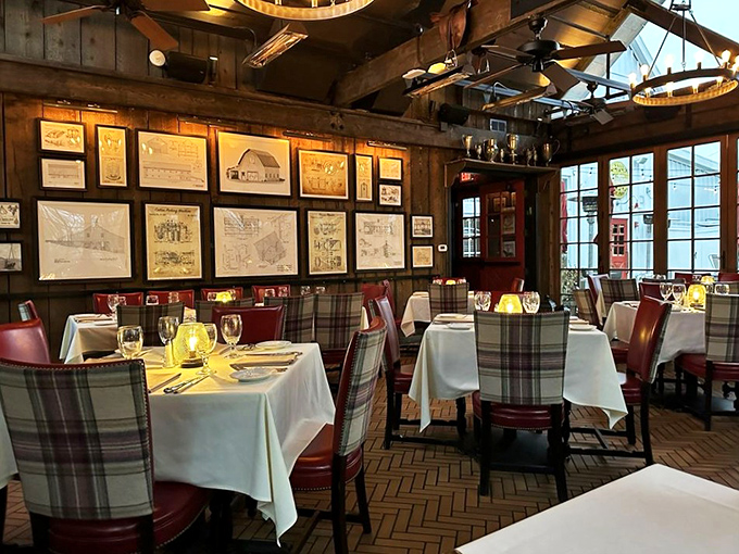 Rustic elegance defines the dining room, where plaid chairs and white tablecloths create the perfect backdrop for serious meat appreciation.