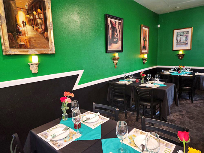 Bold green walls and warm lighting create the perfect backdrop for pasta-fueled conversations that inevitably end with "just one more bite."