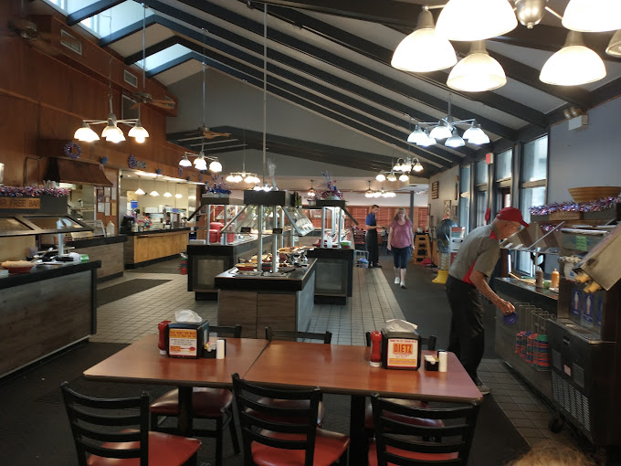 Inside, the spacious dining room with its vaulted ceiling and warm lighting invites you to settle in for the marathon of deliciousness that awaits.