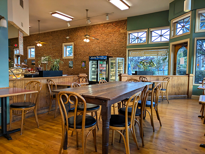 Exposed brick walls and wooden bistro chairs create that perfect "stay awhile" atmosphere where conversations flow as freely as the coffee.