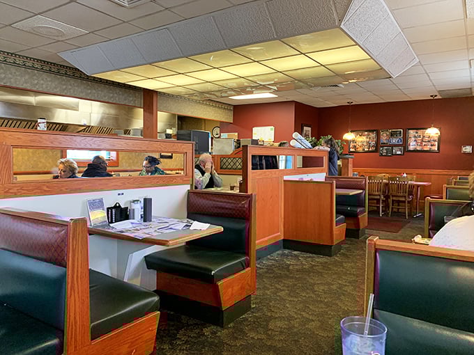 Classic diner booths where breakfast dreams come true. The wood dividers aren't trying to be Instagram-worthy&mdash;they're just doing their job, like everything else at Dom's.