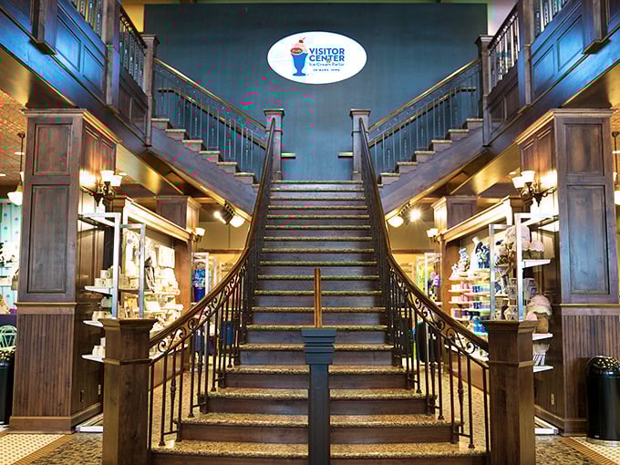 That grand staircase isn't just functional—it's a dramatic entrance to ice cream paradise, flanked by rich wooden details that whisper "this place takes dessert seriously."