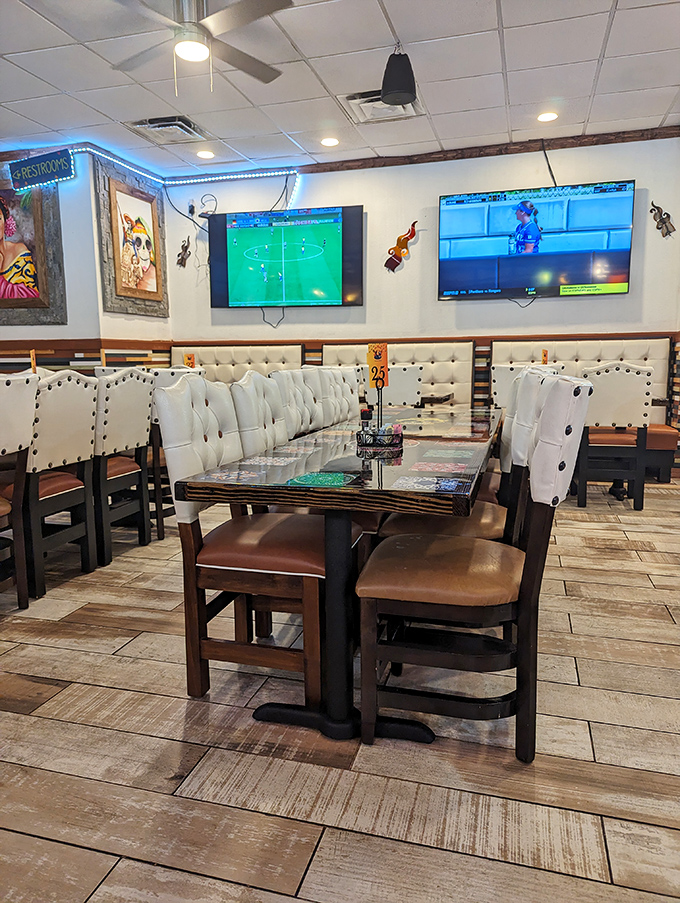 White tufted booths and wooden tables create the perfect backdrop for both game day viewing and serious enchilada contemplation.