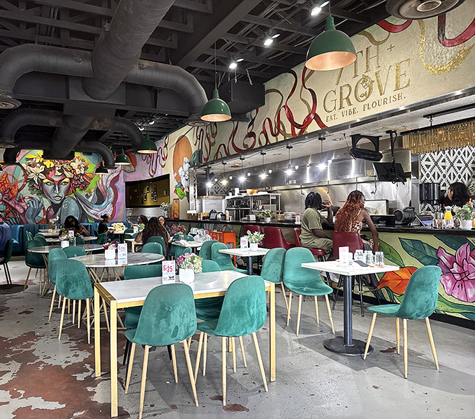 Step inside to a visual feast of vibrant murals, industrial chic fixtures, and those signature teal chairs that practically beg you to settle in for a while.